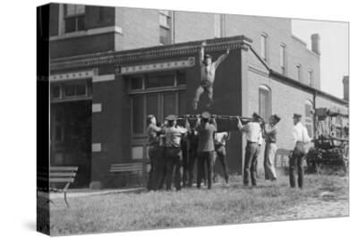 'Firefighter Jumps Into Net Held By Fellow Firemen' Art Print | Art.com