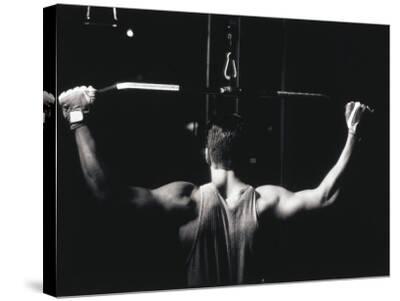 'Rear View of a Young Man Exercise on a Lateral Pull-Down Weight ...