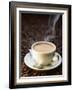 'A Steaming Cup of Coffee on Coffee Beans' Photographic Print - Peter ...