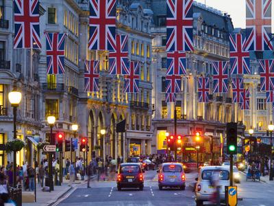 'UK, England, London, Regent Street, Taxis and Union Jack Flags ...