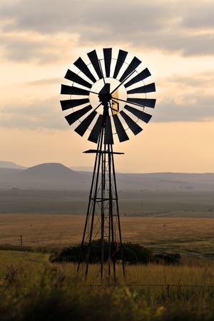 'An Old Windmill on a Farm in a Rural or Rustic Setting at Sunset ...