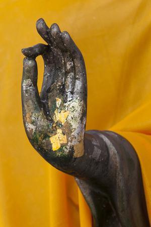 'Thailand. Buddha Statue hand with gold leaf tokens.' Photographic ...