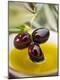 'Dipping Olive Sprig with Black Olives in Olive Oil' Photographic Print ...