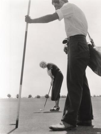 'Female Golfer and Her Caddy' Photo | Art.com