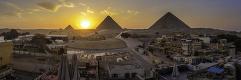 View of Giza Pyramids from rooftop terrace at sunset, Cairo, Egypt ...
