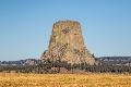 Devil's Tower National Monument, a rare form of igneous rock, rises out ...