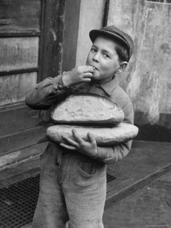 'Little Boy Holding Loaves of Bread' Photographic Print - Walter ...