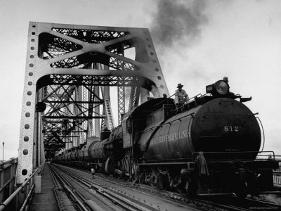 'Long String of Tank Cars Rumbling Across the 4 1/2 Mile Huey Long ...