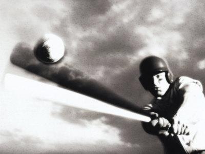 'Low Angle View of a Baseball Player Swinging a Baseball Bat ...