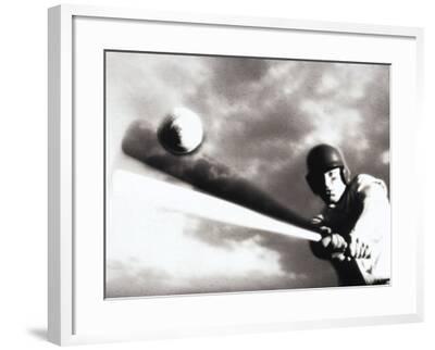 'Low Angle View of a Baseball Player Swinging a Baseball Bat ...