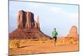 Runner. Running Man Sprinting in Monument Valley. Athlete Runner Cross ...