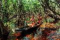 'Men from the Yanomami tribe in a canoe, southern Venezuela ...