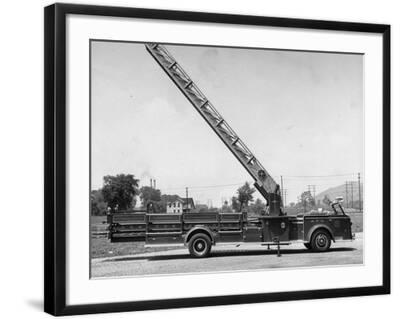 Modern Fire Engine, with Ladder Rising Above Truck Framed Photographic ...