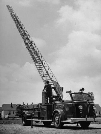 'Modern Fire Engine, with Men Raising Ladder Above Truck' Photographic ...