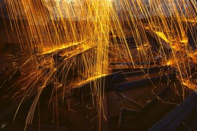 'Sparks from an Acetylene Cutting Torch Fall onto Broken Steel Girders ...