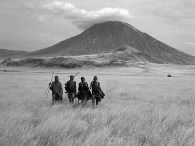 'Maasai Warriors Stride across Golden Grass Plains at Foot of Ol Doinyo ...