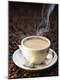 'A Steaming Cup of Coffee on Coffee Beans' Photographic Print - Peter ...