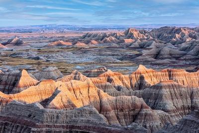 Formations of striated hoodoo lead the eye to a plateau and more peaks ...
