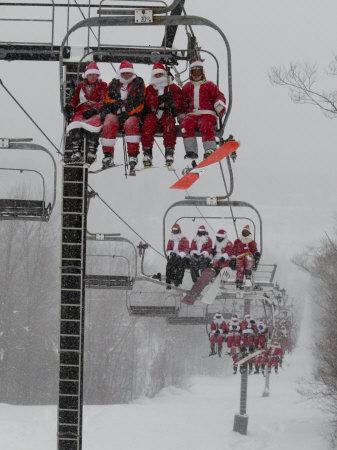 'Skiers and Snowboarders Dressed as Santa Claus Ride up the Ski Lift ...
