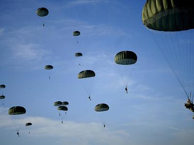 'Soldiers Descend Under a Parachute Canopy During Operation Toy Drop ...