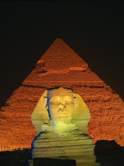 Sphinx and One of the Pyramids Illuminated at Night, Giza, Cairo, Egypt ...