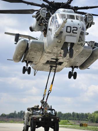 'U.S. Marines Conduct a Sling Load Operation with a CH-53E Super ...