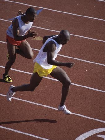 'Two Men Racing on a Track' Photographic Print | Art.com