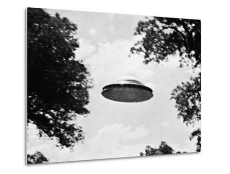 UFO Flying Low over Trees Photographic Print by | Art.com
