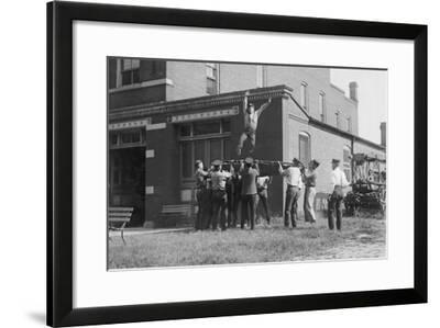 Firefighter Jumps Into Net Held By Fellow Firemen Art Print by | Art.com