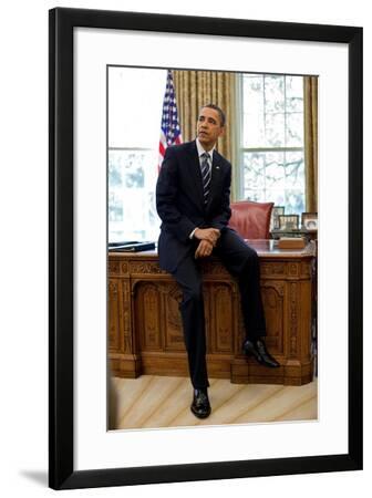 President Barack Obama Sits on the Edge of the Resolute Desk in the ...