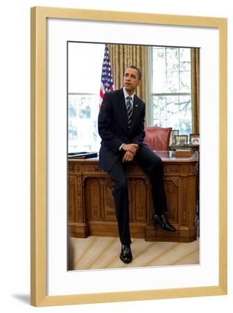 President Barack Obama Sits on the Edge of the Resolute Desk in the ...