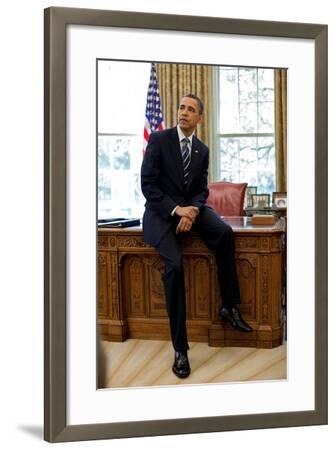 President Barack Obama Sits on the Edge of the Resolute Desk in the ...