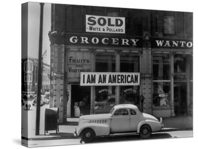 I Am an American Sign on a Store Front Photo by | Art.com