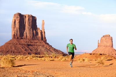 Runner. Running Man Sprinting in Monument Valley. Athlete Runner Cross ...