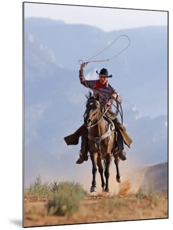 Cowboy Running with Rope Lassoo in Hand, Flitner Ranch, Shell, Wyoming ...