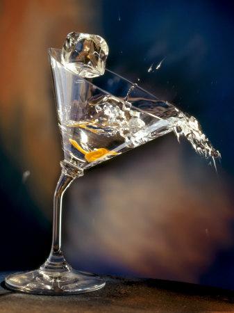 'Vodka Martini Spilling from a Bent Martini Glass with Ice Cube ...