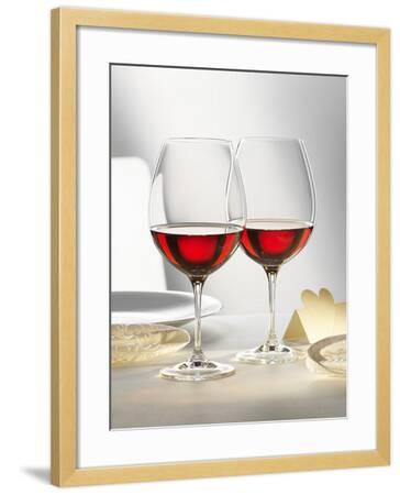 Two Glasses of Red Wine on Festive Table Photographic Print by ...