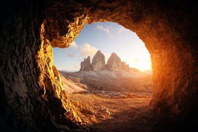 View from the cave in mountain against Three peaks of Lavaredo during ...