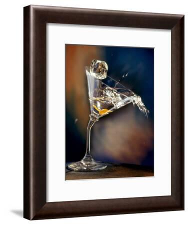 Vodka Martini Spilling from a Bent Martini Glass with Ice Cube ...