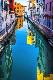 'Colorful small canal creating beautiful reflection in Venice, Italy ...