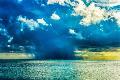 'Rain storm cloud, Moorea, Tahiti, French Polynesia. Blue colors in ...